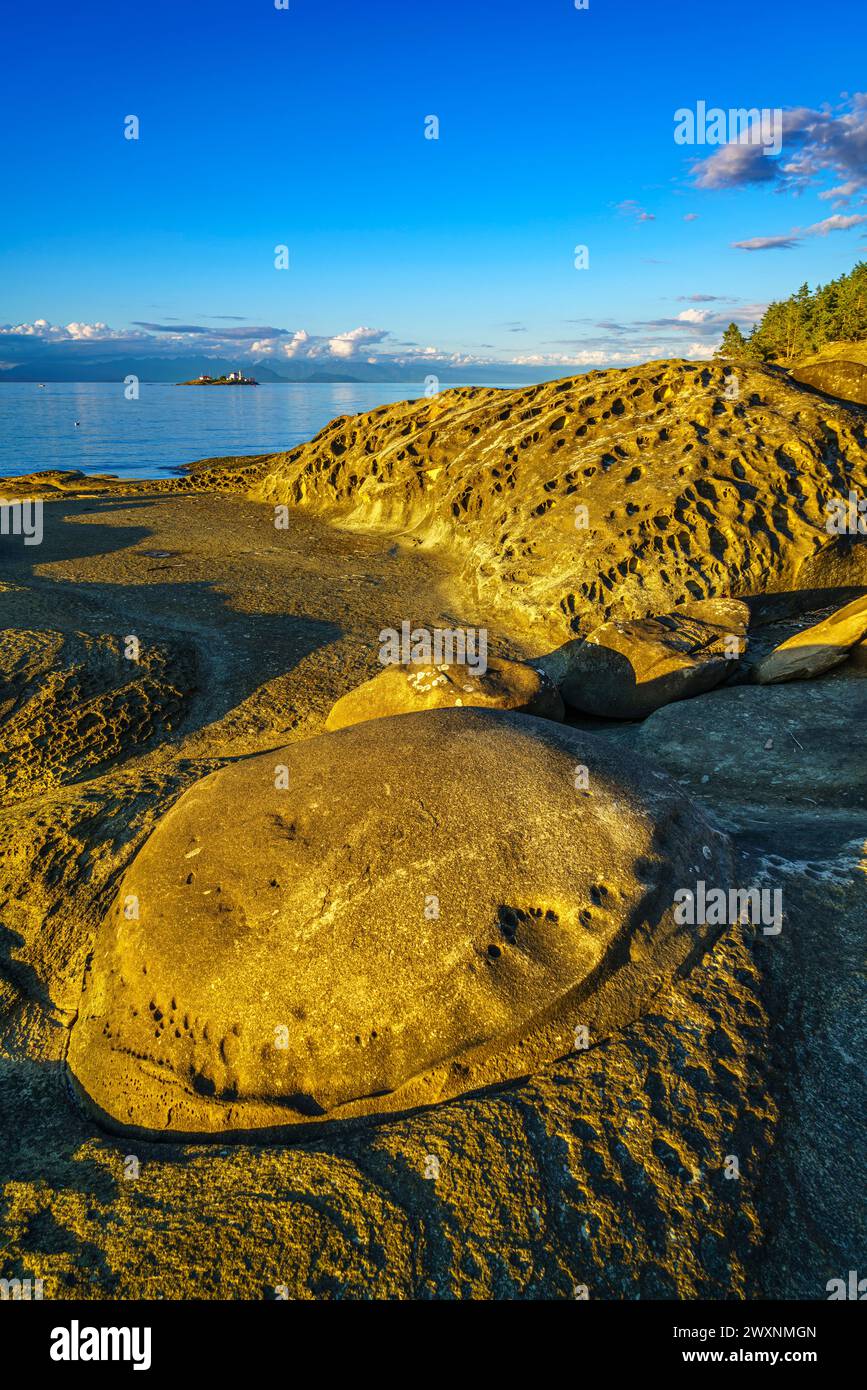 Weathered sandstone rock formations known as tafoni along the northeast ...