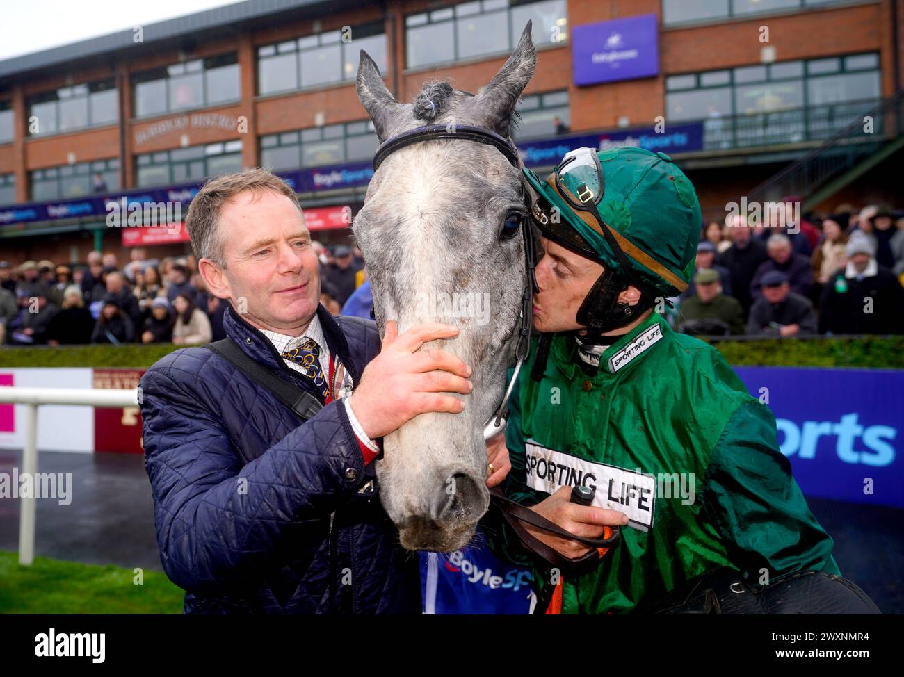 Jockey J J Slevin and trainer Thomas Gibney pose for a photo with ...