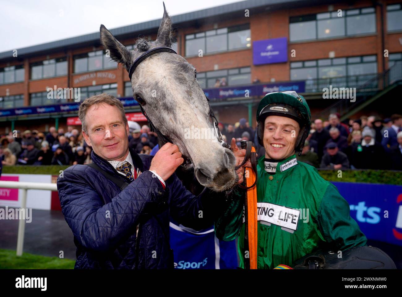 Jockey J J Slevin and trainer Thomas Gibney pose for a photo with ...