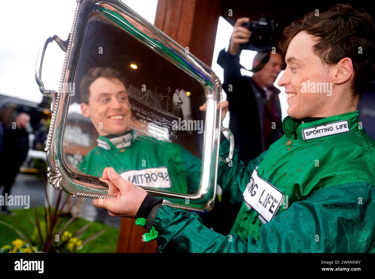 Jockey J J Slevin celebrates with the trophy after winning the ...