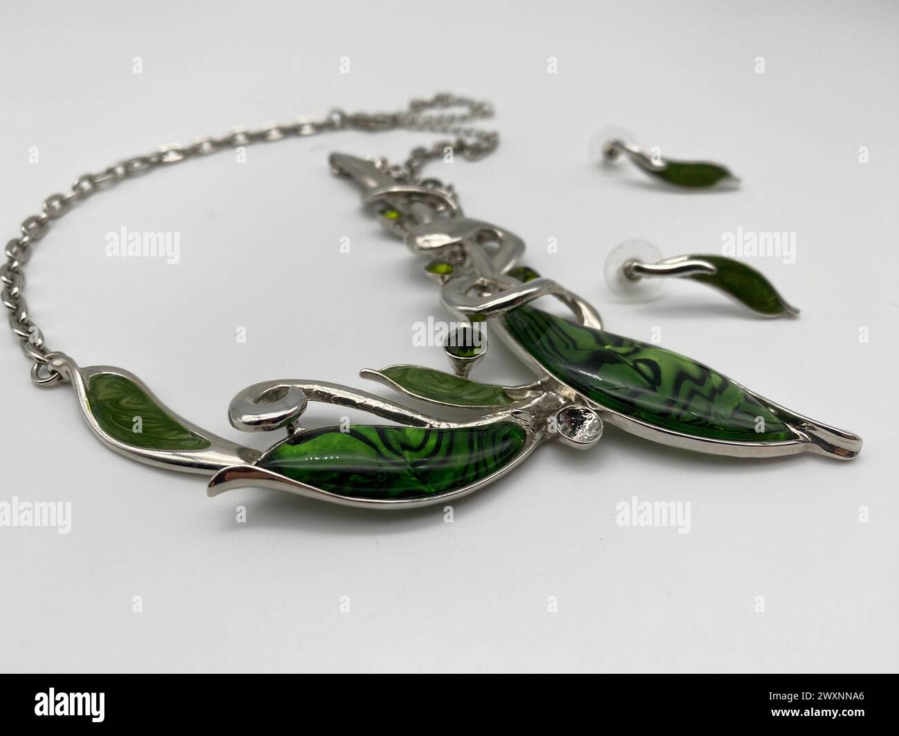 An overlapping necklace on a flat surface Stock Photo - Alamy