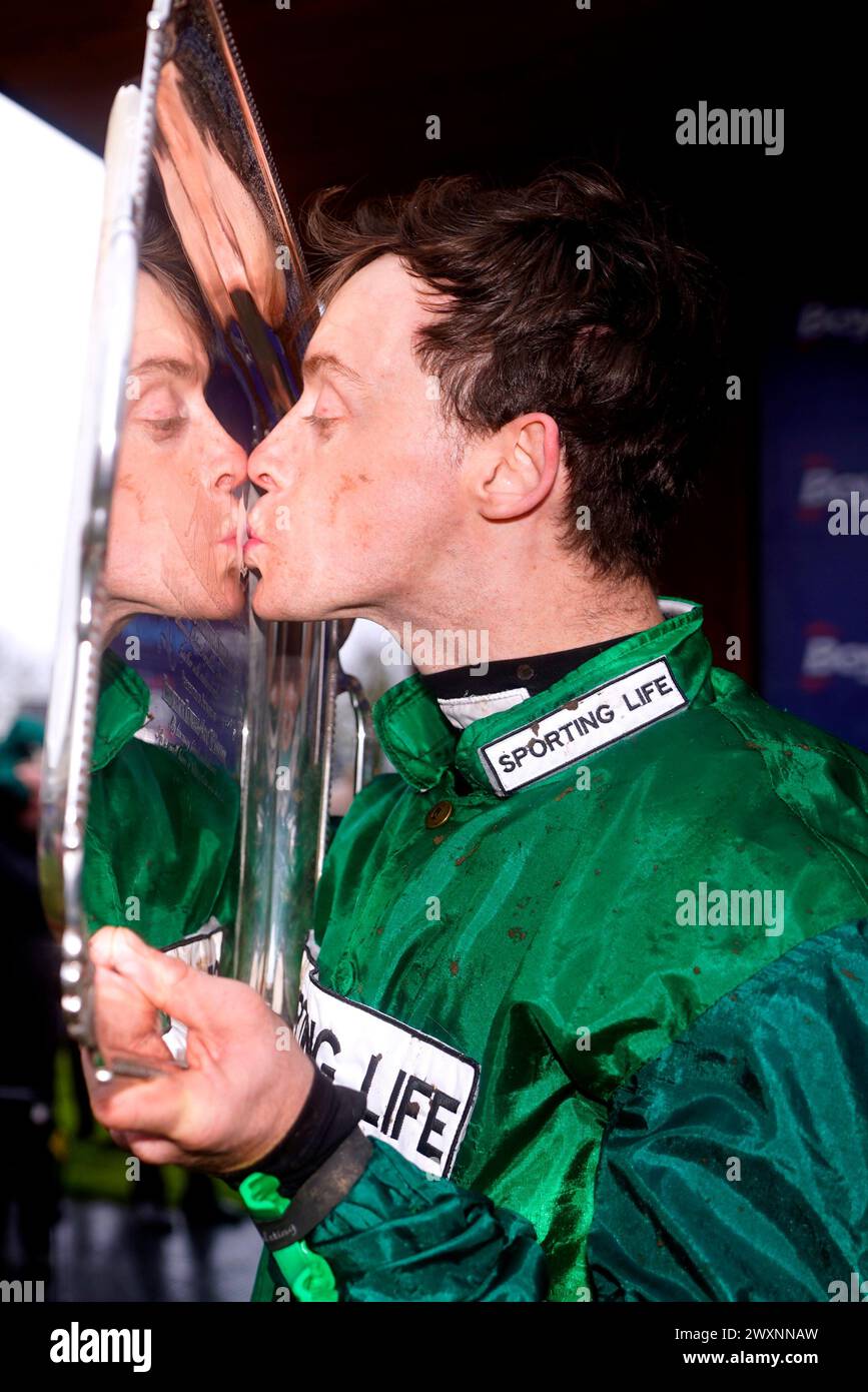 Jockey J J Slevin celebrates with the trophy after winning the ...