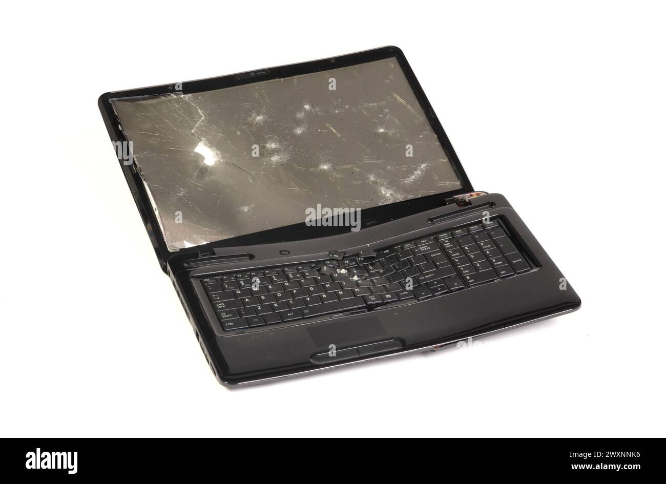 Old broken laptop isolated on white a background Stock Photo - Alamy
