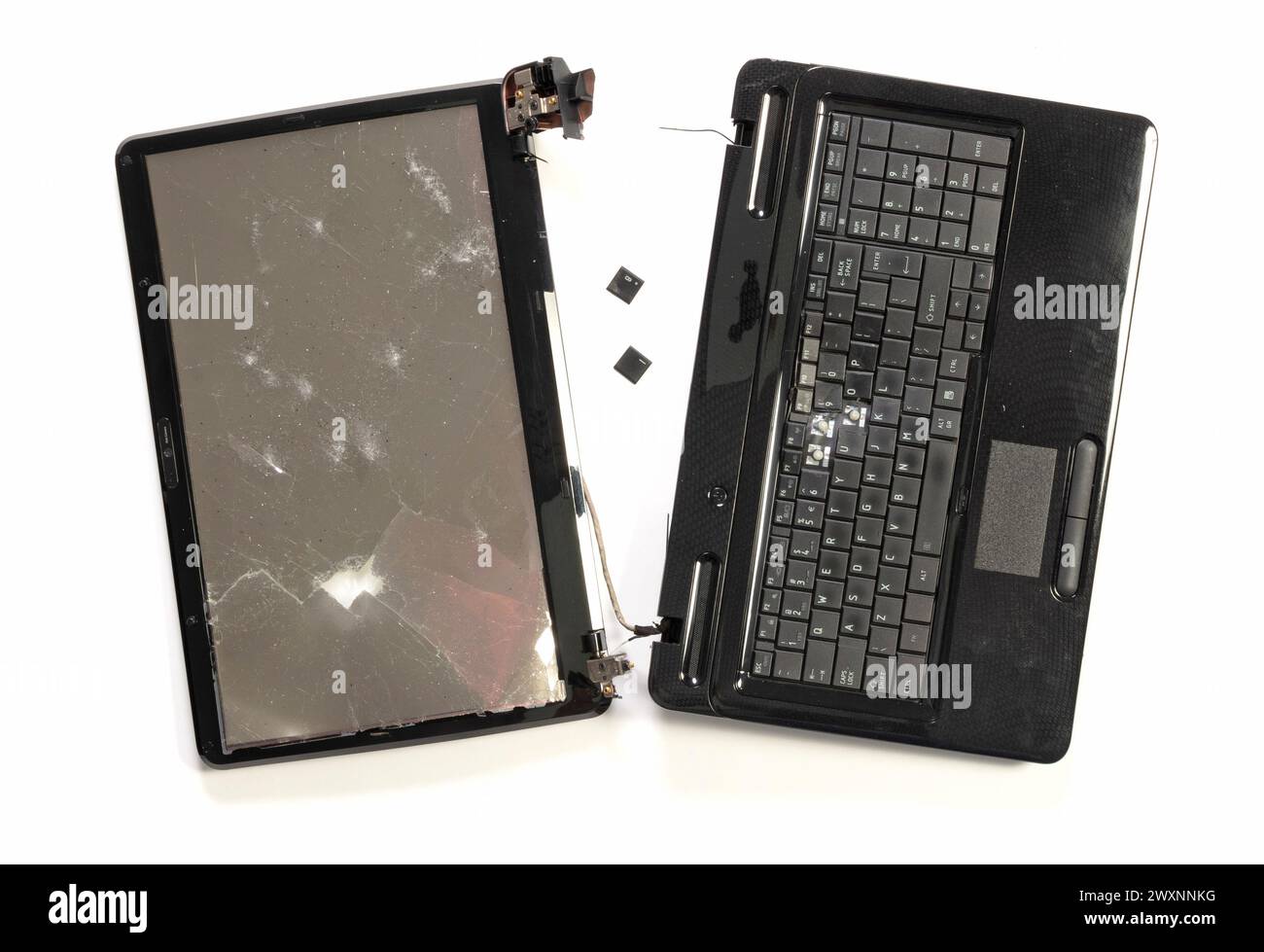 Old broken laptop isolated on white a background Stock Photo - Alamy