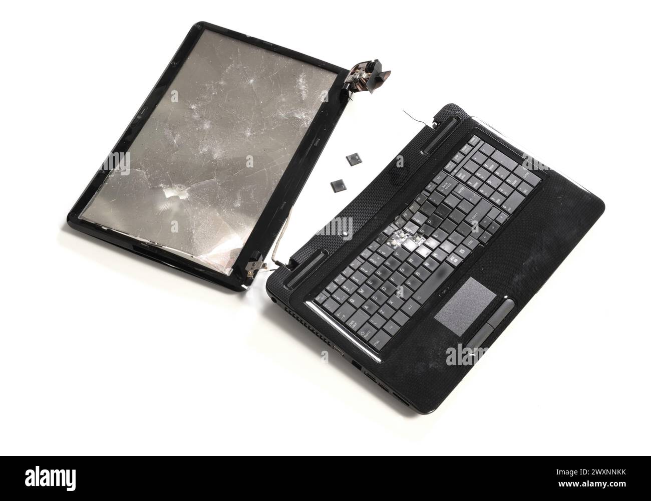 Old broken laptop isolated on white a background Stock Photo - Alamy