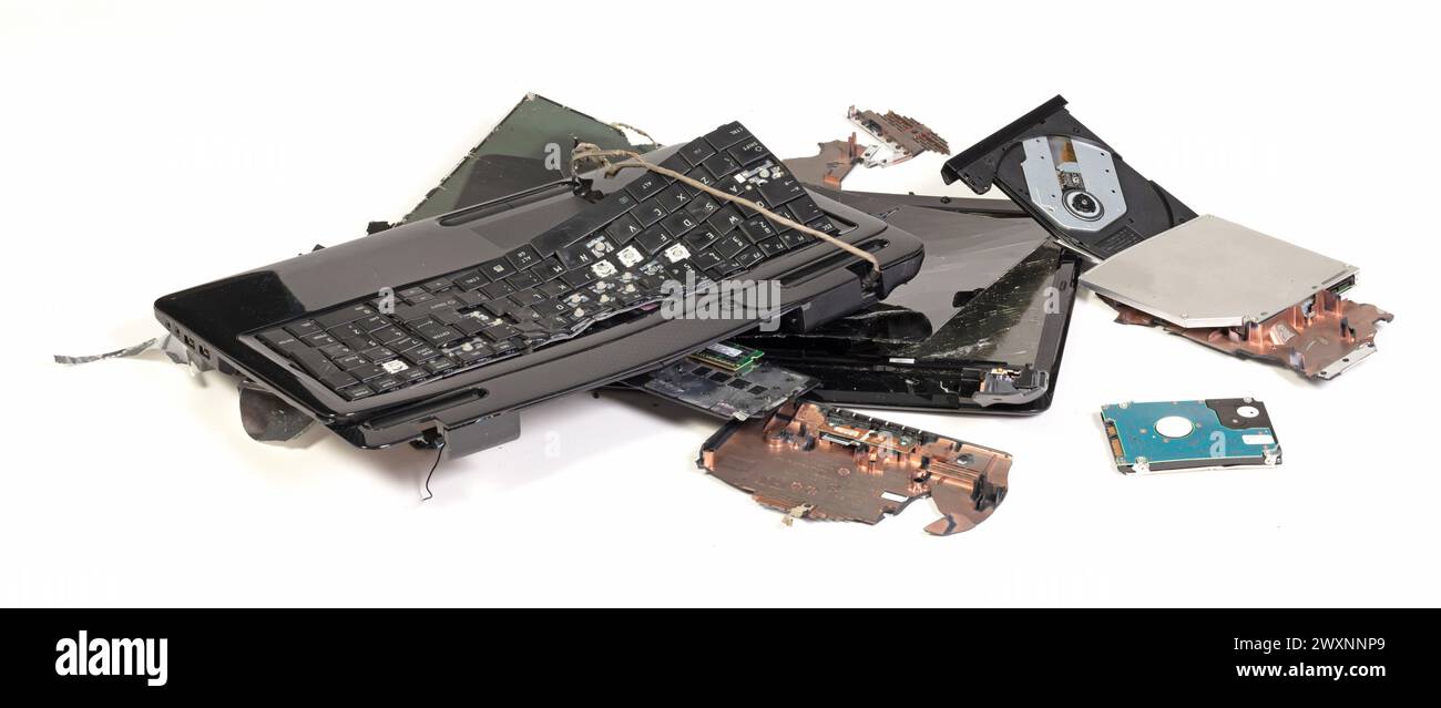 Old broken laptop isolated on white a background Stock Photo - Alamy
