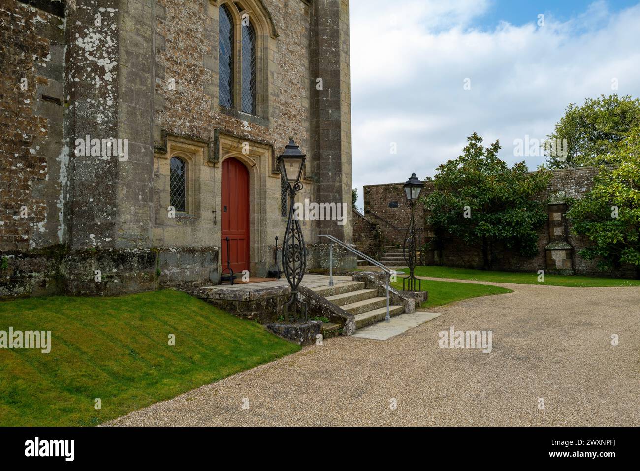 Red door side entrance to Parham House in Sussex, England. An ...