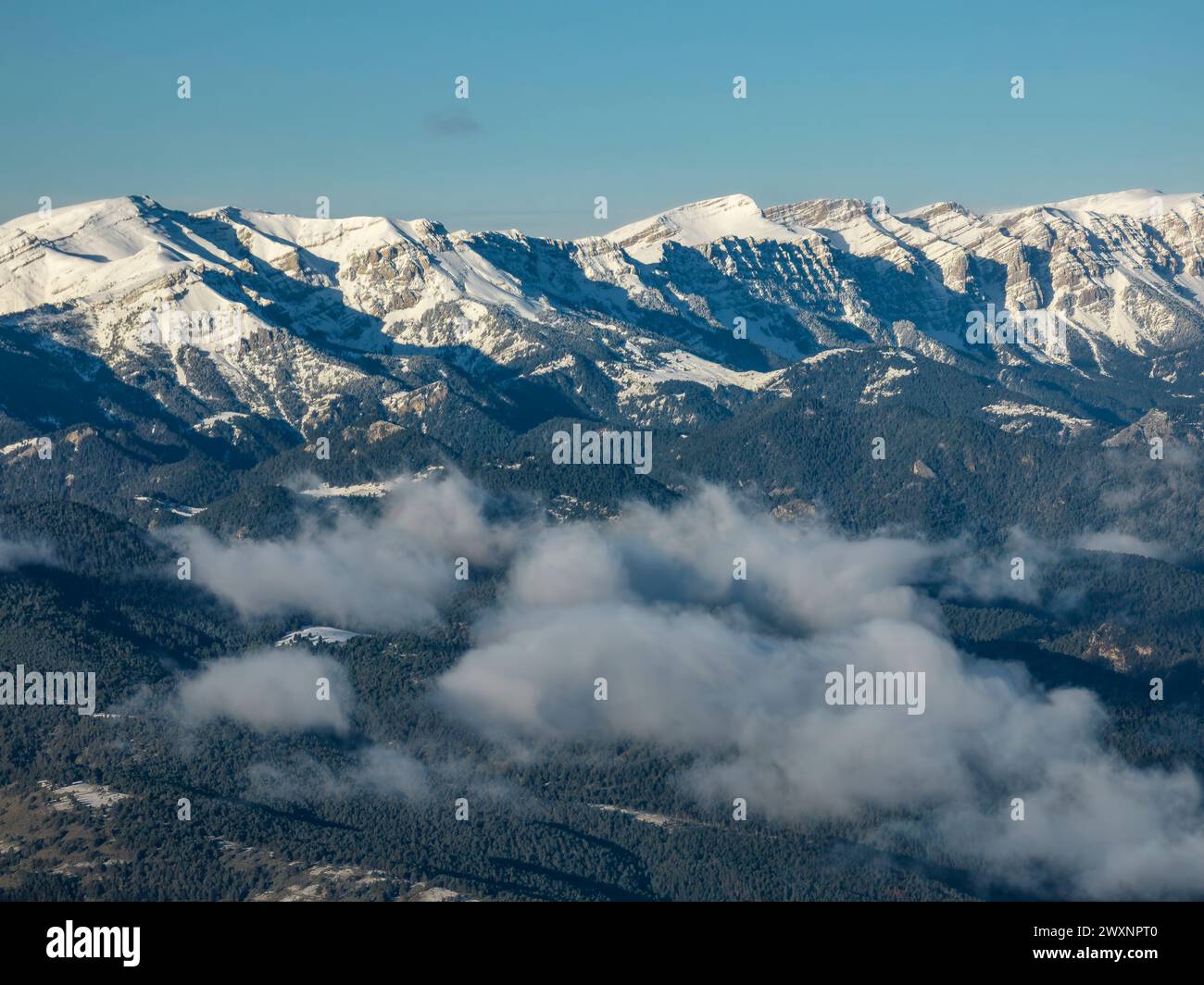 Aerial view of snow-capped Serra del Cadí mountains (Cerdanya ...