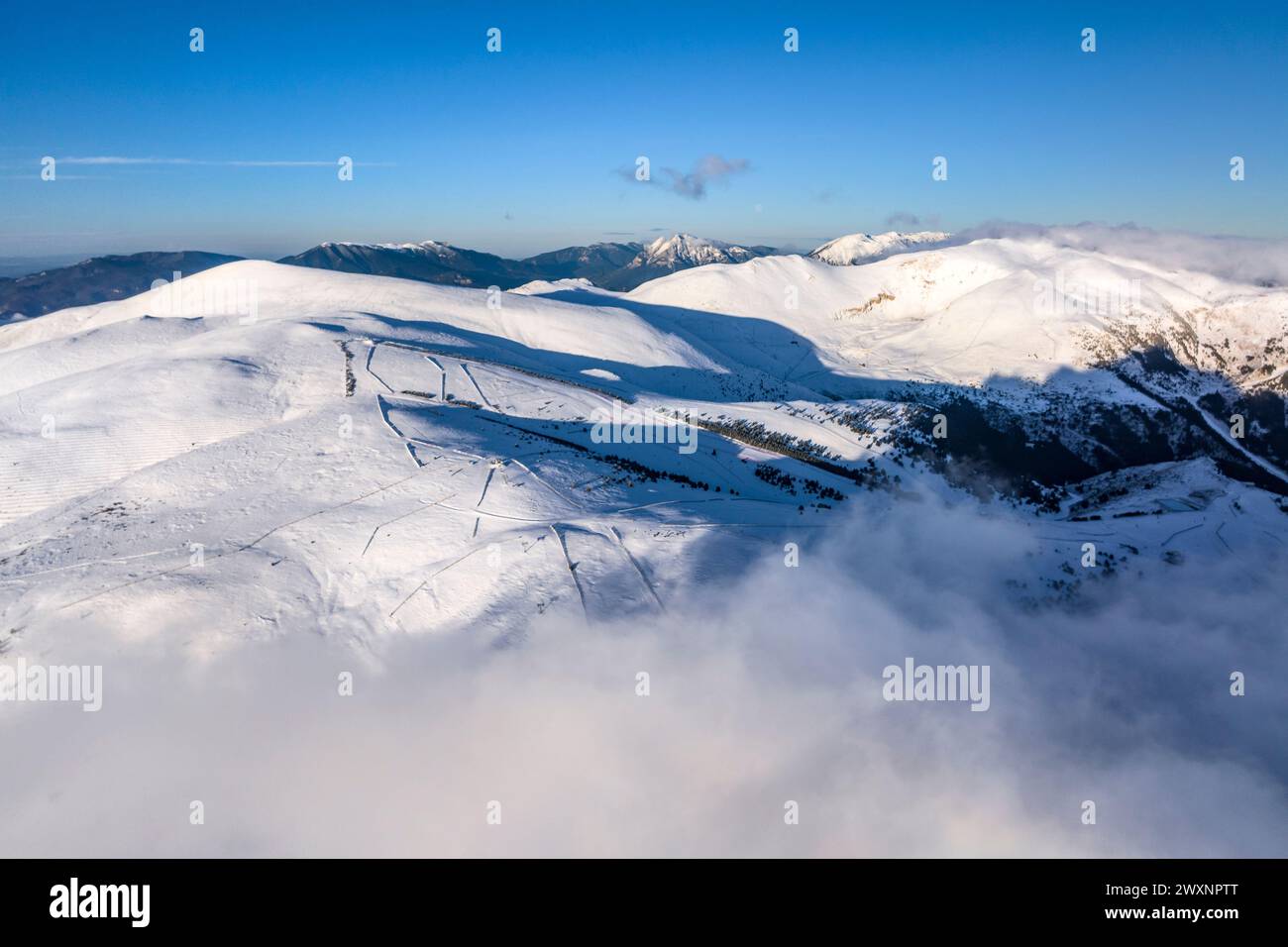 Aerial view of the snow-capped Puigllançada, Tosa d'Alp and Pedraforca ...