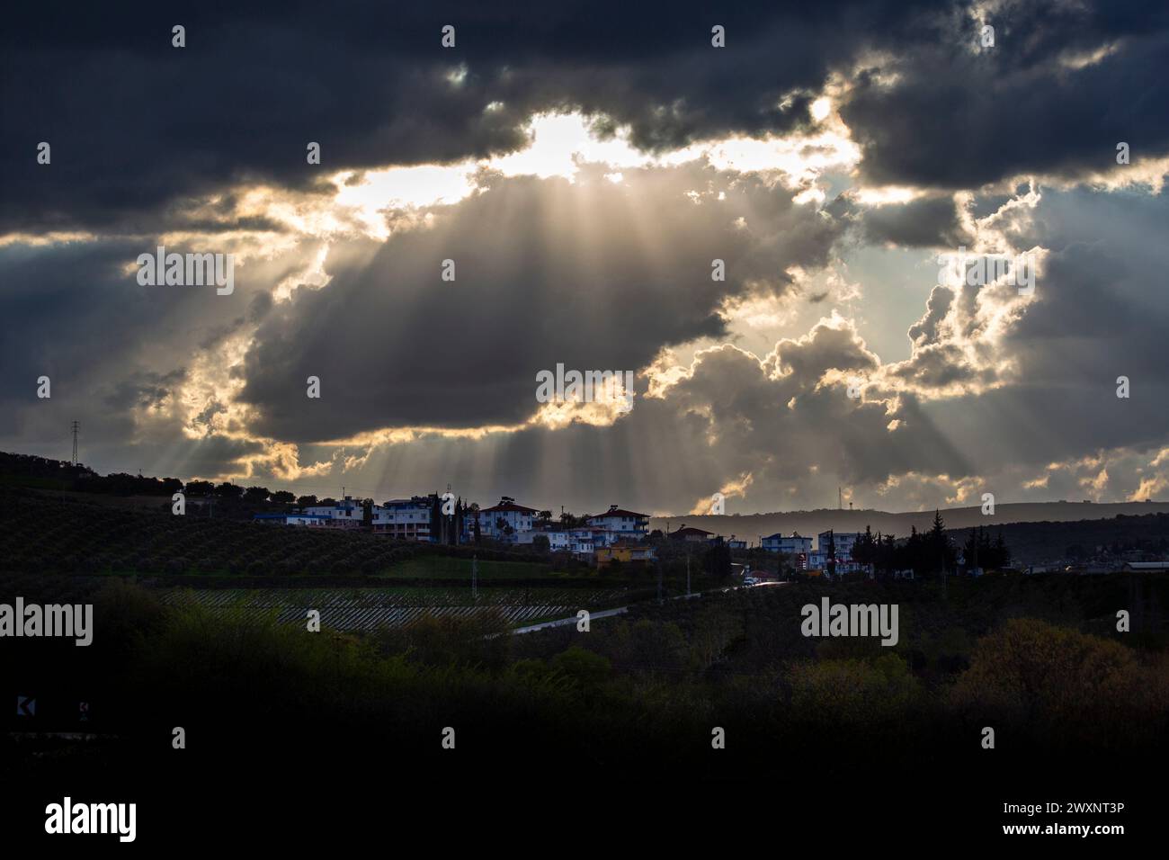 Some rain on the town light beam Stock Photo - Alamy