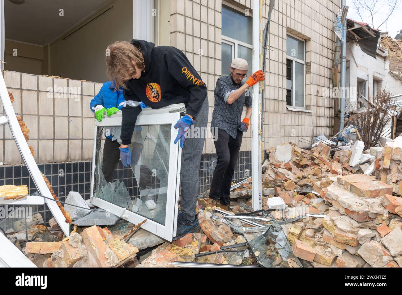 Students and teachers of the academy are seen dismantling the remains ...