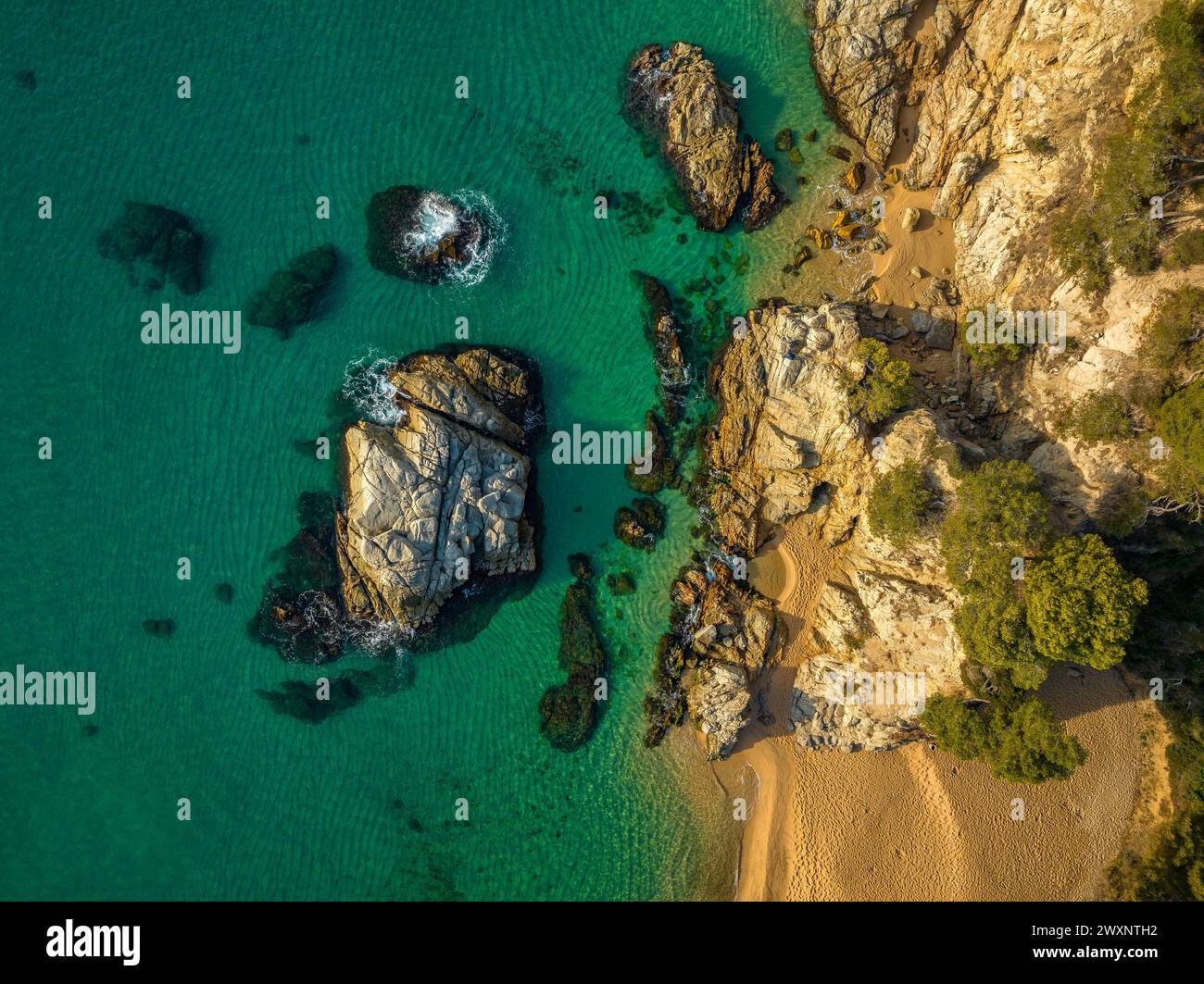Aerial view of the coast with rocks and cliffs near the sea in Lloret ...
