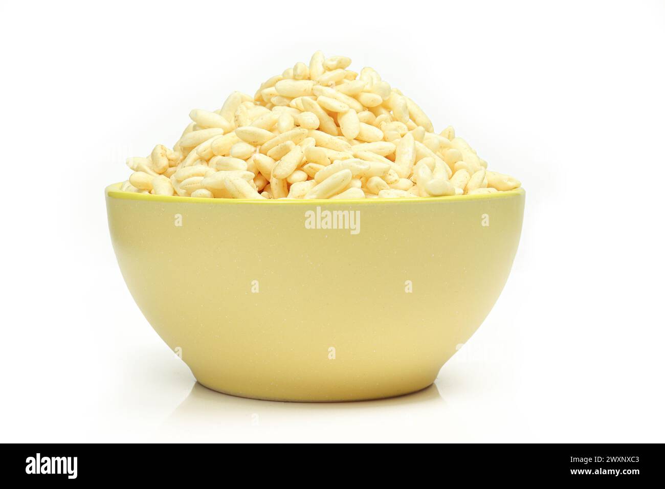 Full bowl of puffed rice isolated on white background Stock Photo - Alamy