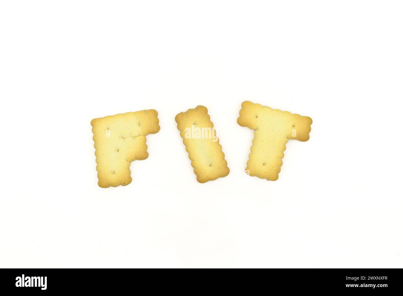 Capital letter shaped biscuits forming word fit isolated on white ...