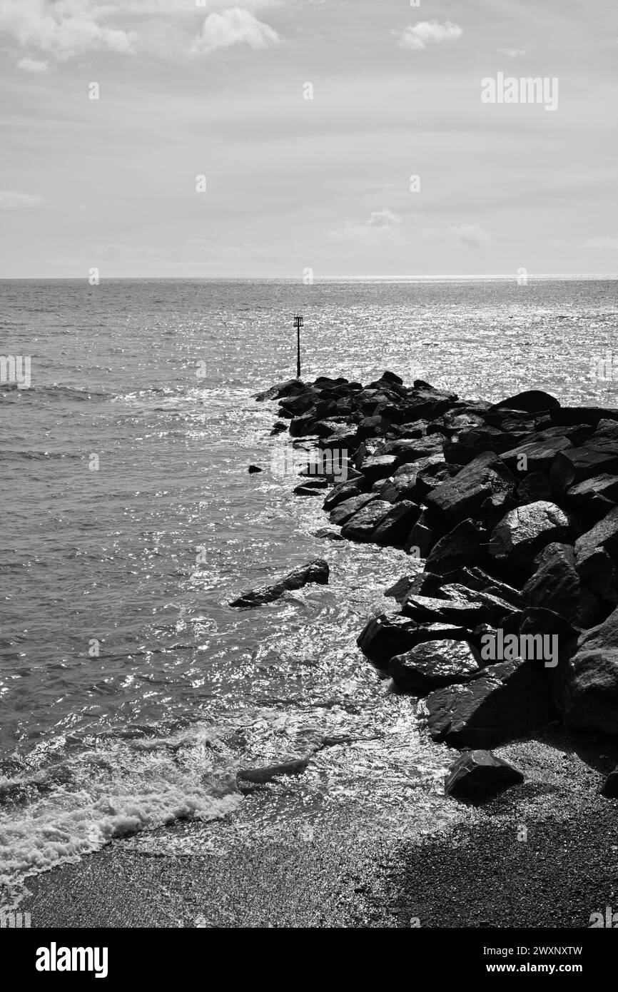 Groyne or breakwater built of rocks at Sidmouth, Devon, England, UK ...