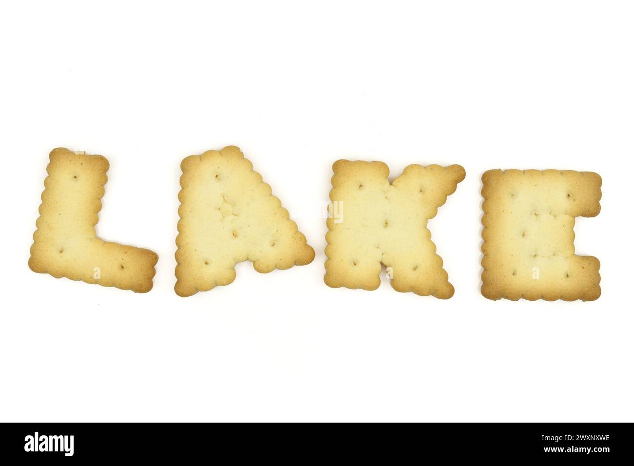Capital letter shaped biscuits forming word LAKE isolated on white ...