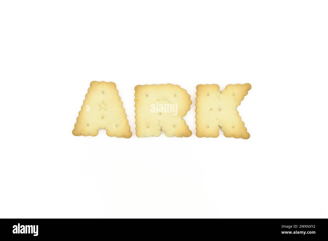 Capital letter shaped biscuits forming word ARK isolated on white ...