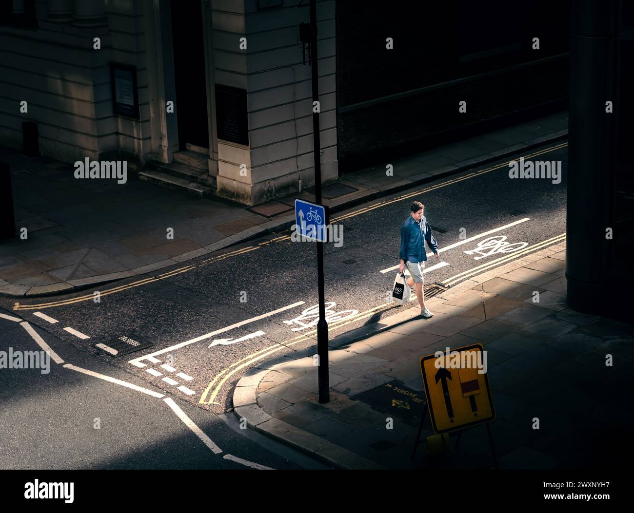 London - 19 July 2020 - Street Photography of Man Walking with Shaft of ...