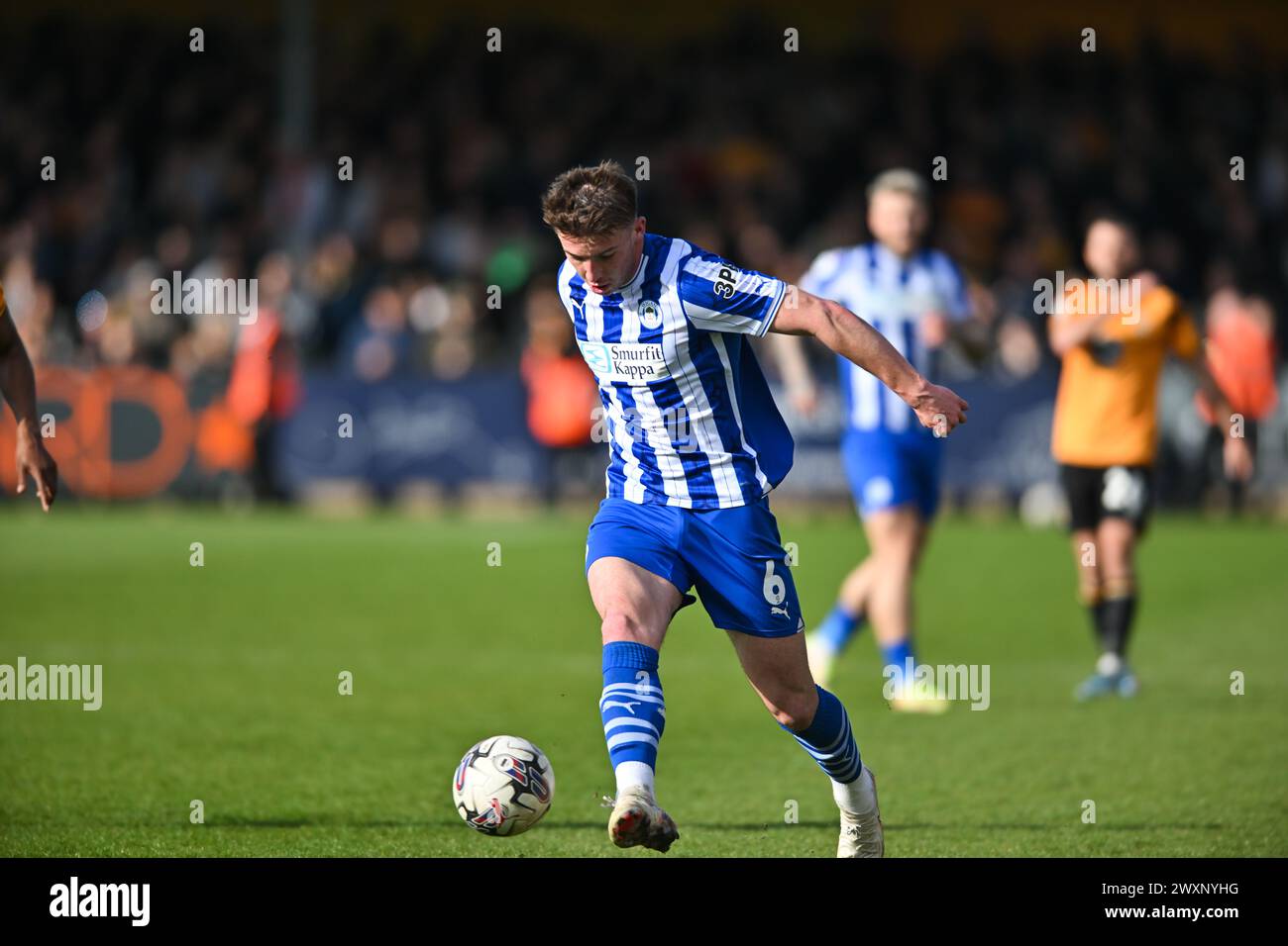 Cambridge on Monday 1st April 2024. Charlie Hughes (6 Wigan Athletic ...