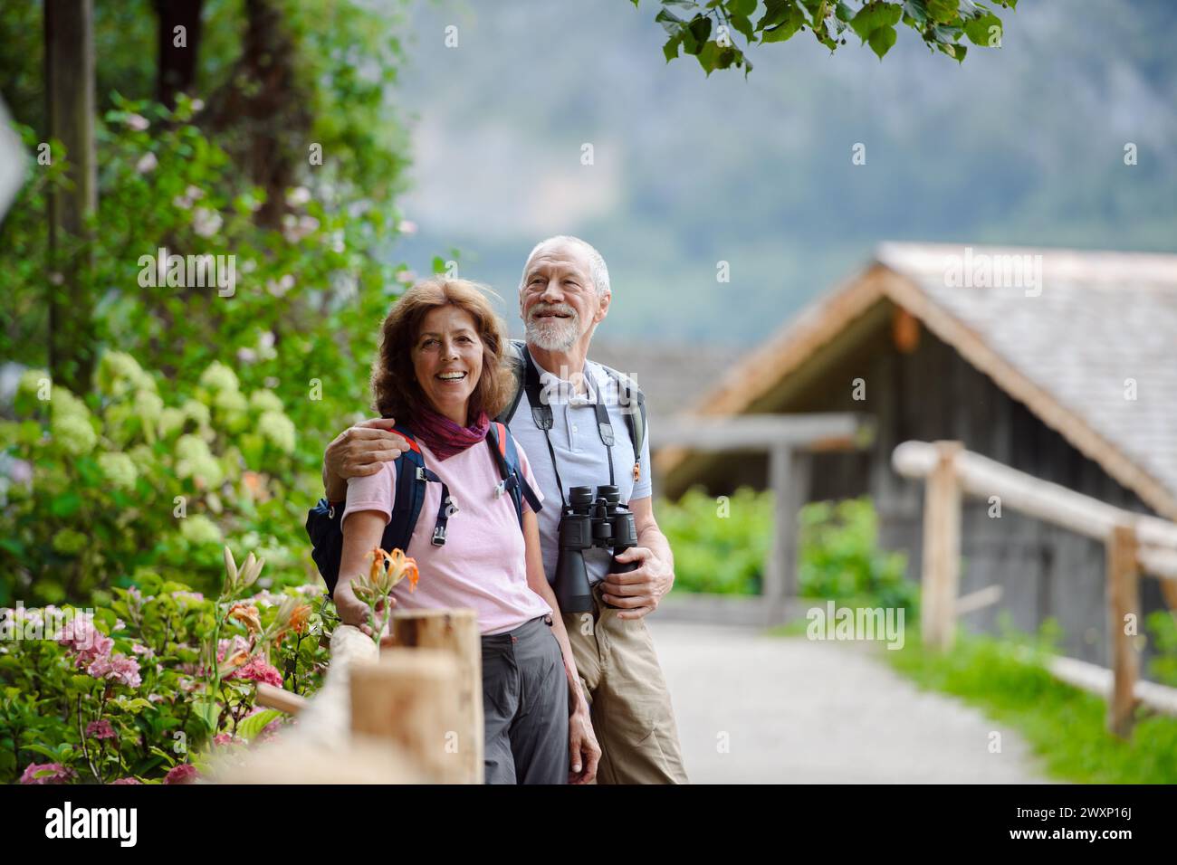 Active elderly couple on trip together, during spring day. Senior ...