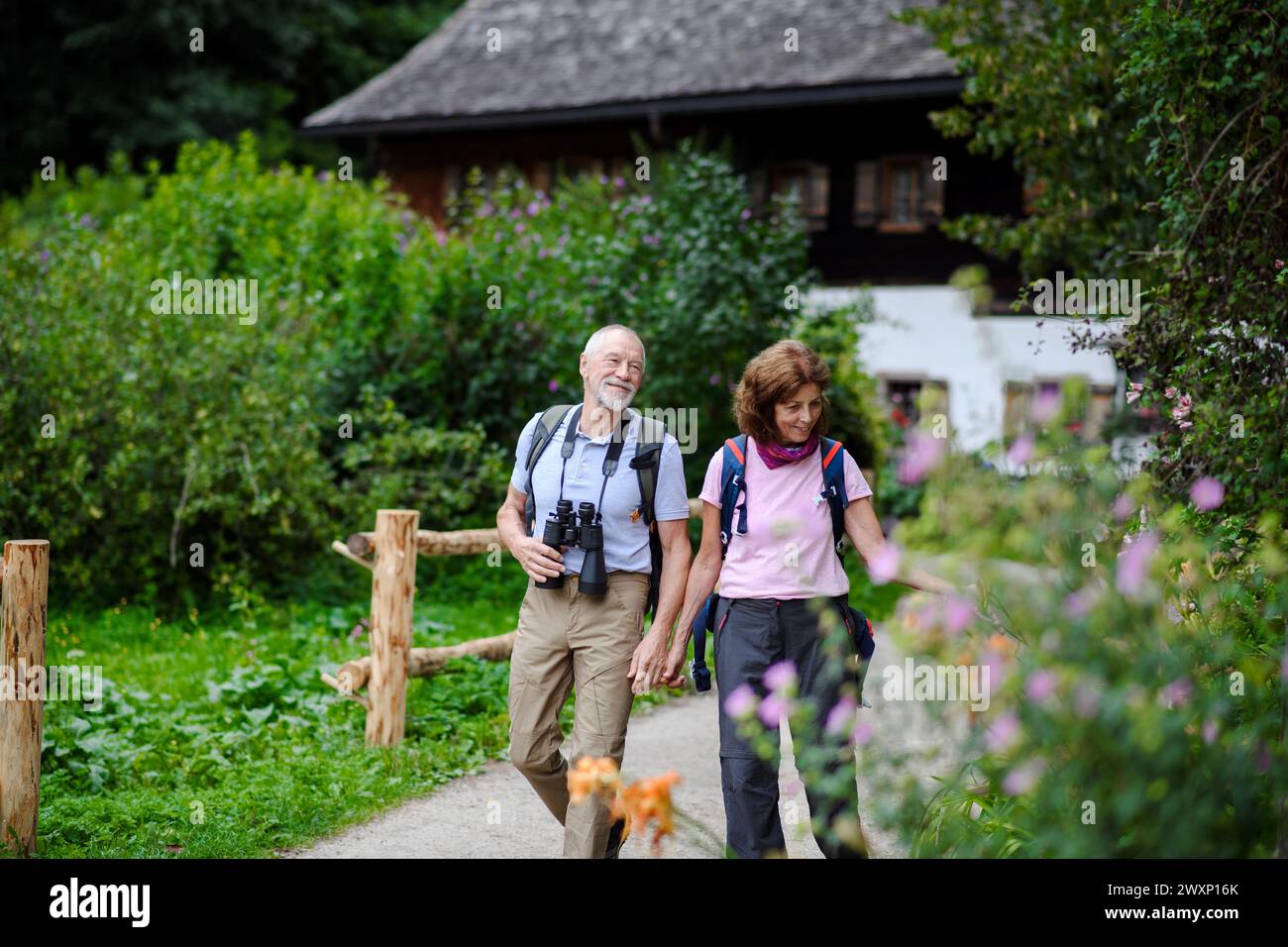 Active elderly couple on trip together, during spring day. Senior ...