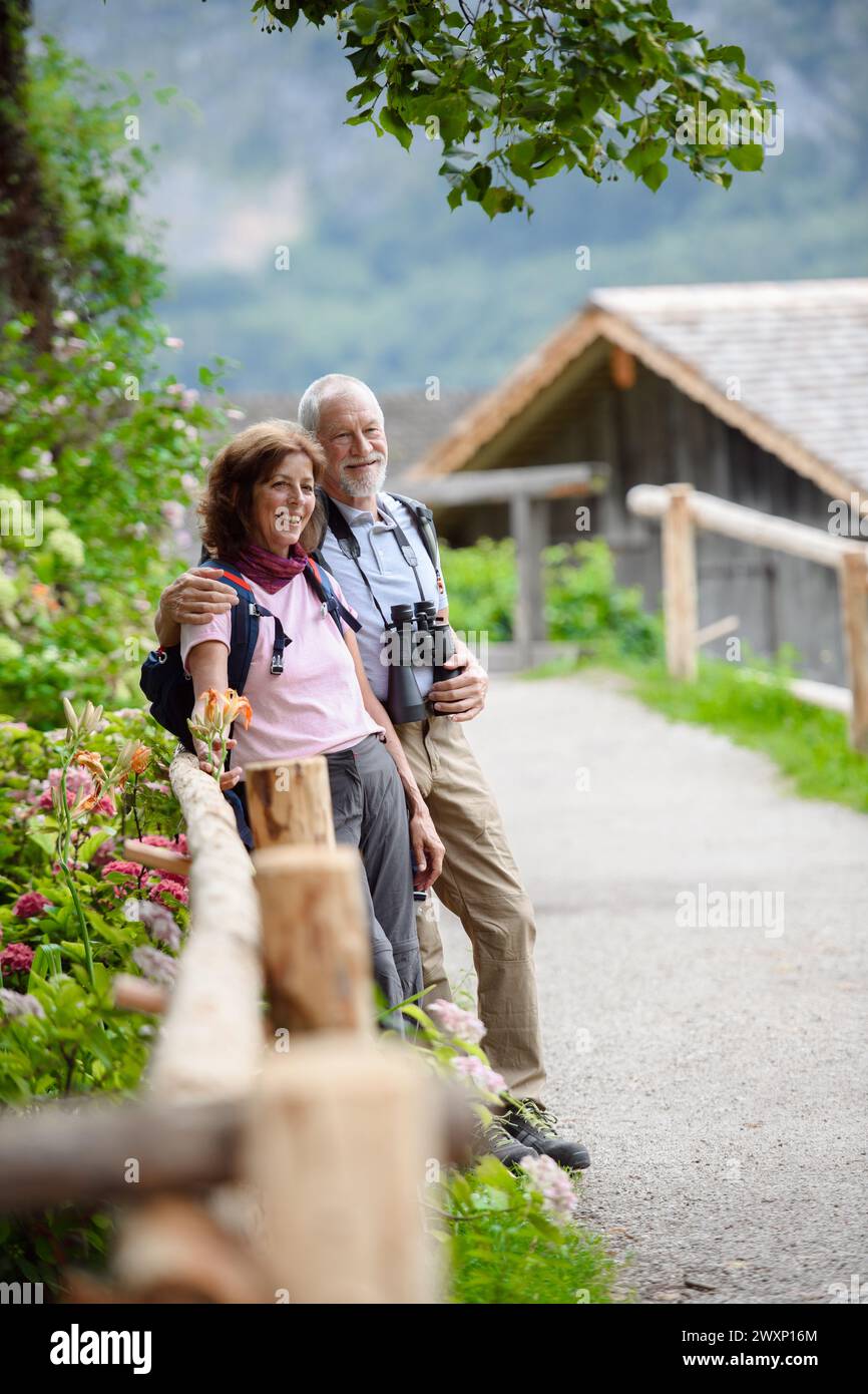 Active elderly couple on trip together, during spring day. Senior ...