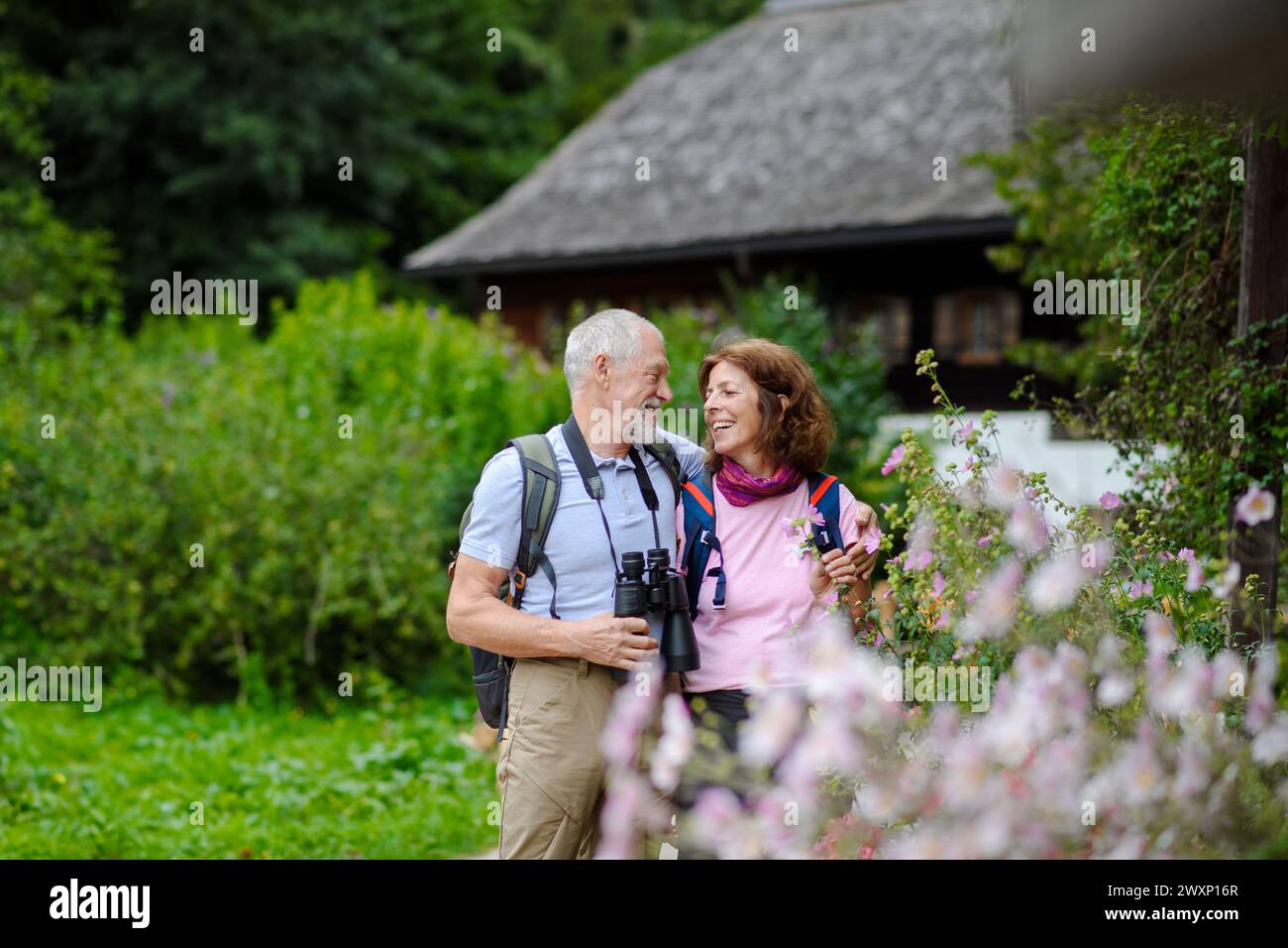 Active elderly couple on trip together, during spring day. Senior ...