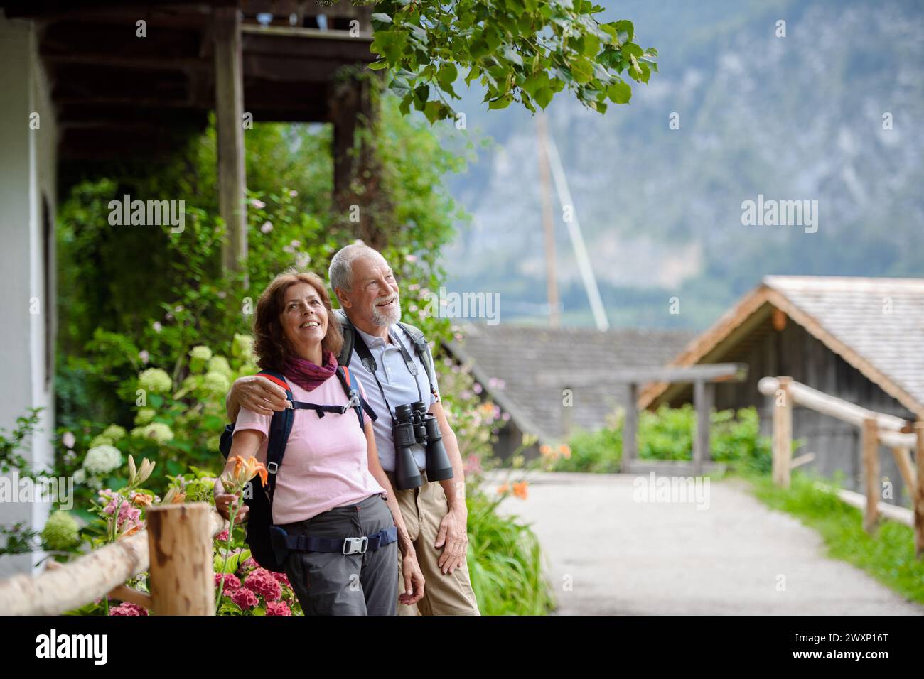 Active elderly couple on trip together, during spring day. Senior ...