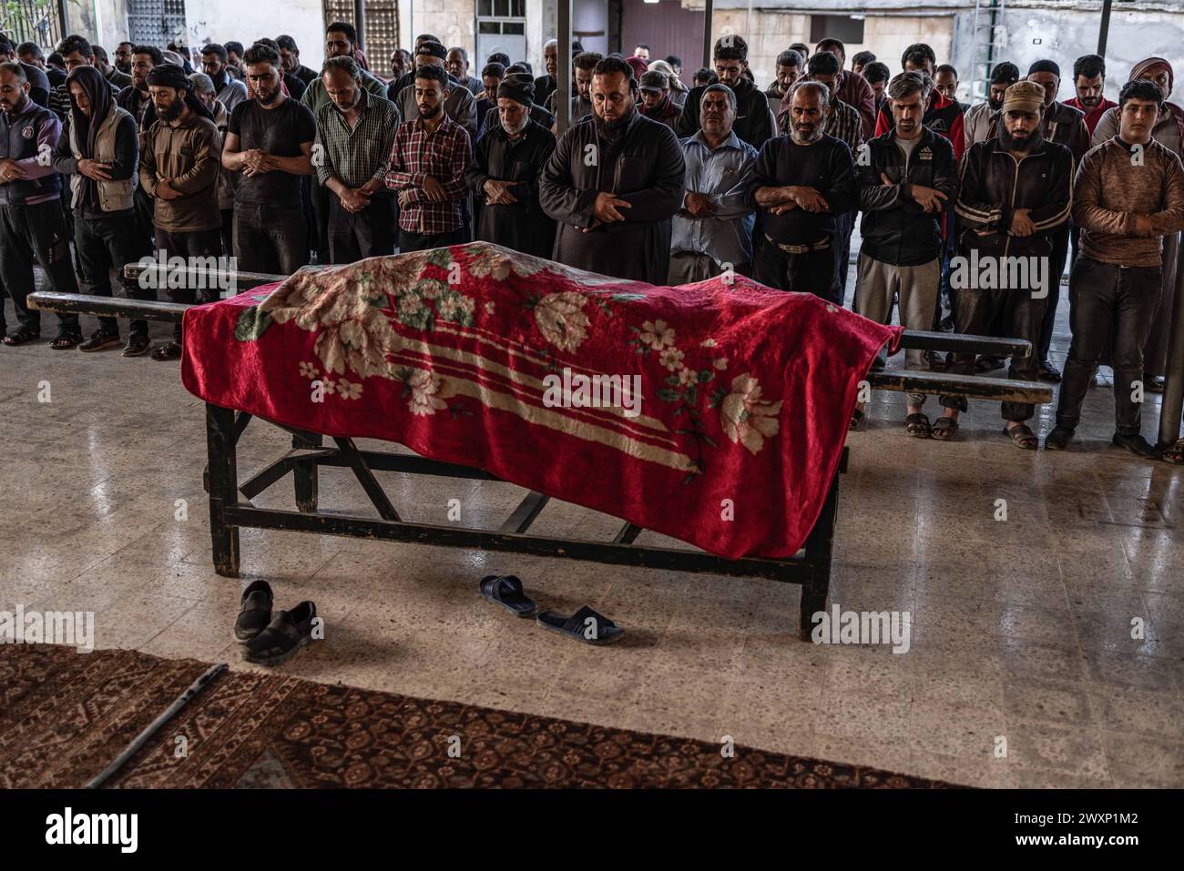 Sarmin, Syria. 01st Apr, 2024. People pray during the funeral of the ...