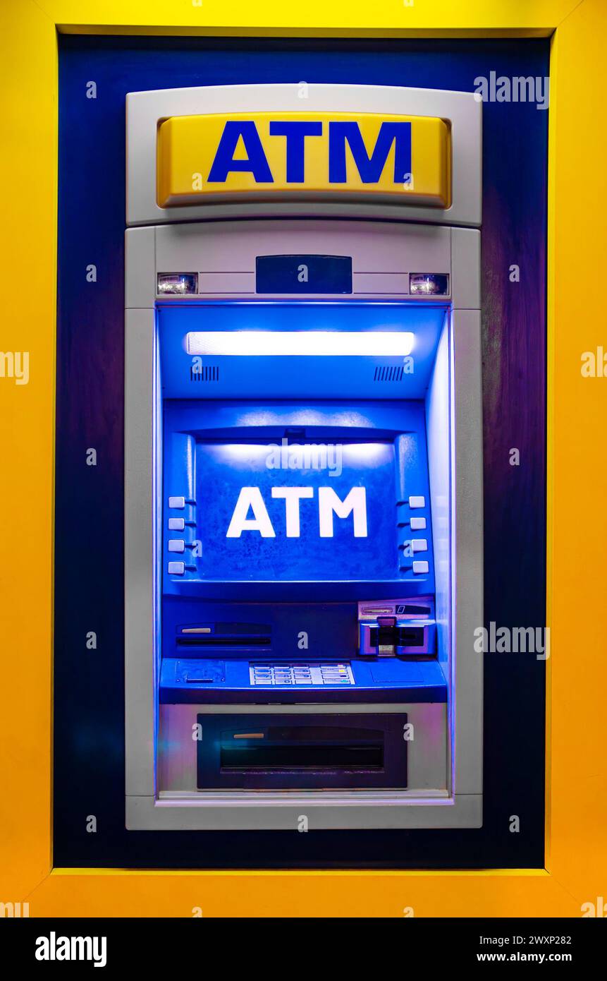 Illuminated automated teller machine at night Stock Photo - Alamy