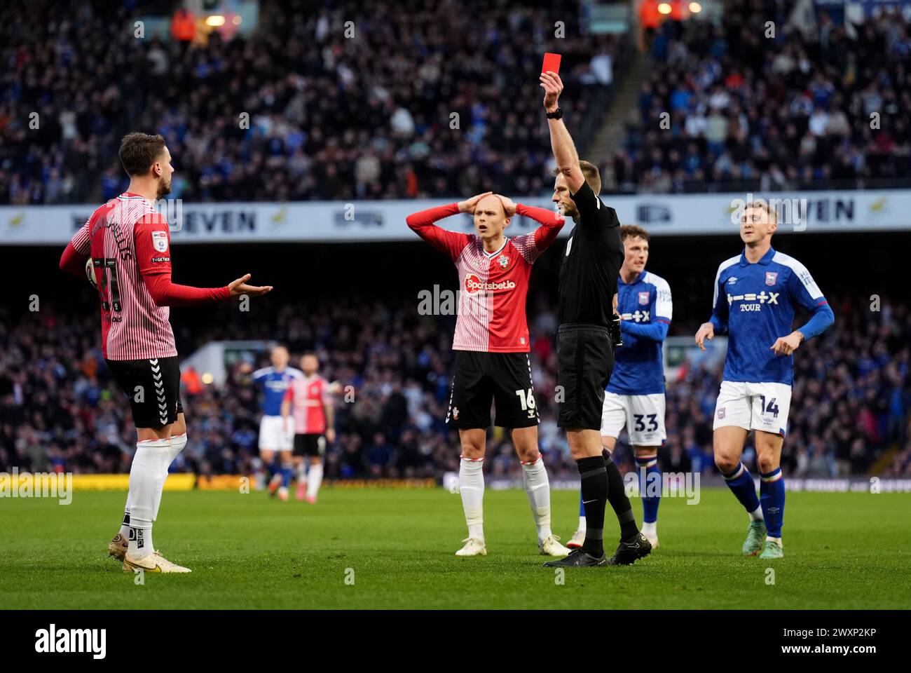 Southampton's James Bree (not pictured) is shown a red card by referee ...
