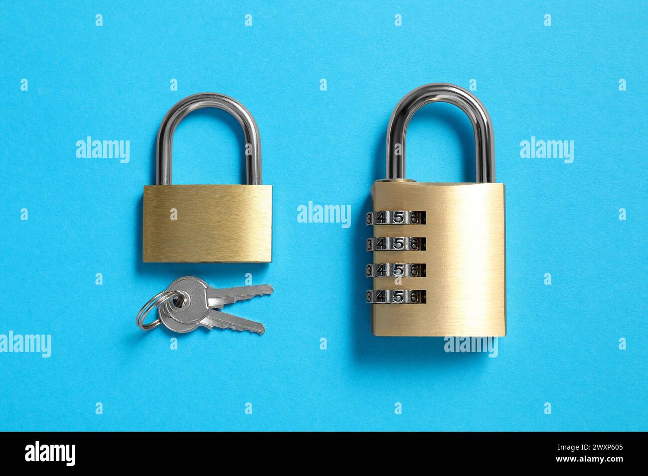 Different padlocks and keys on light blue background, top view Stock ...