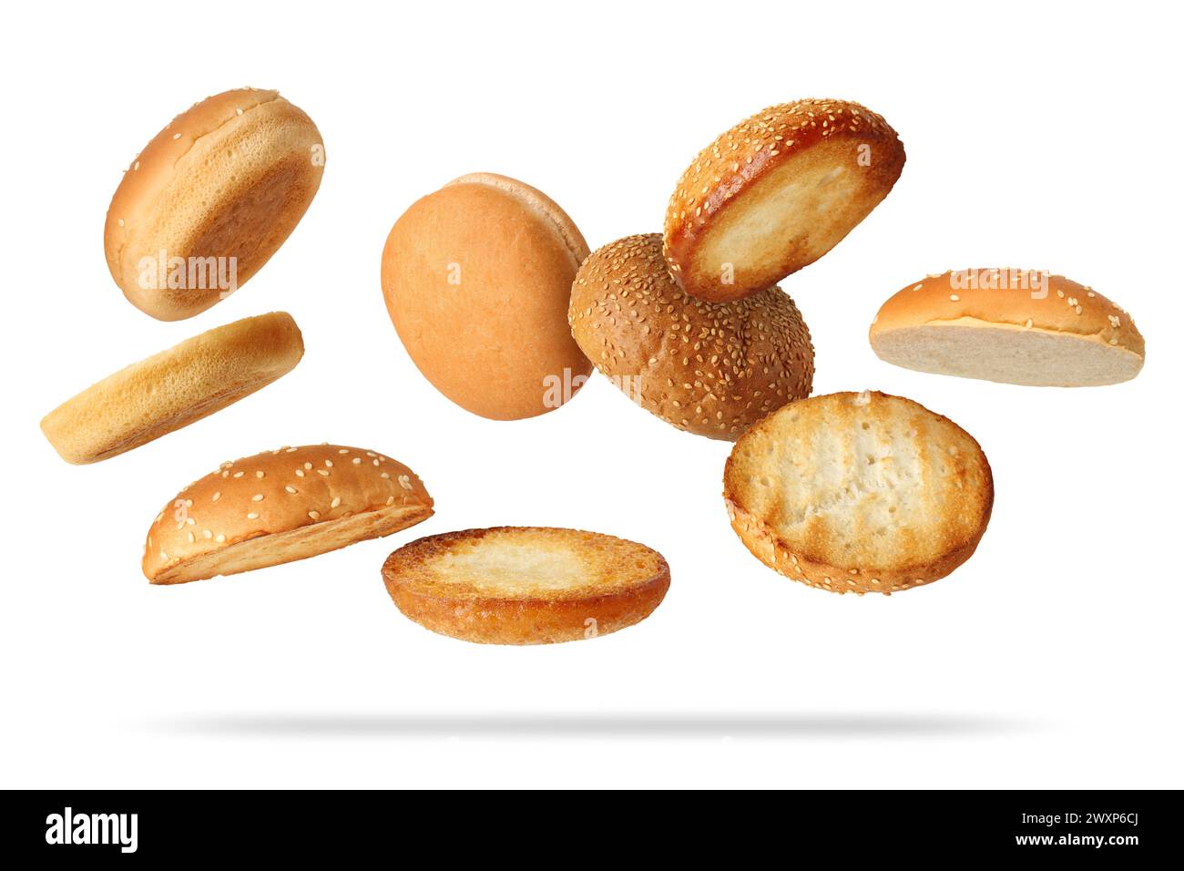 Fresh burger buns falling on white background Stock Photo - Alamy