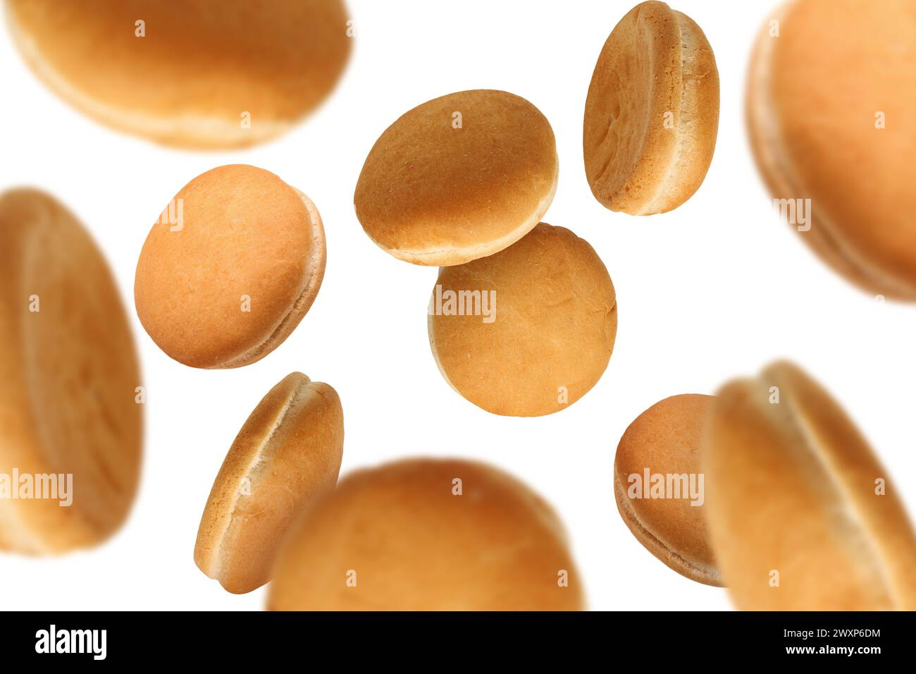Fresh burger buns falling on white background Stock Photo - Alamy