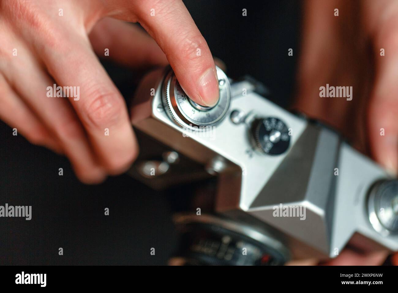 A close-up view of a persons hands holding a camera, ready to take a ...