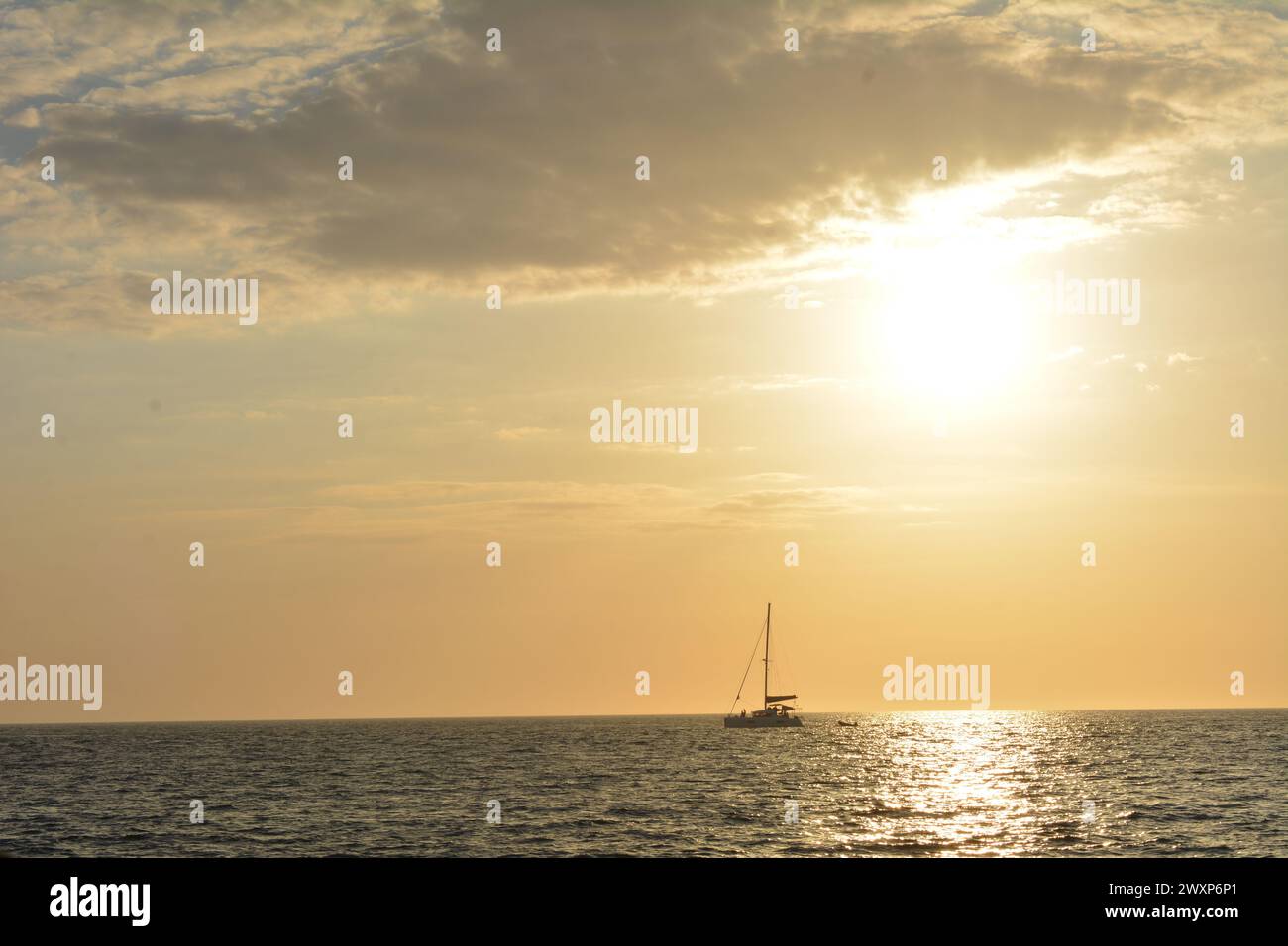 Small sailing vessel in sunset on Pacific by Costa Rica Stock Photo - Alamy