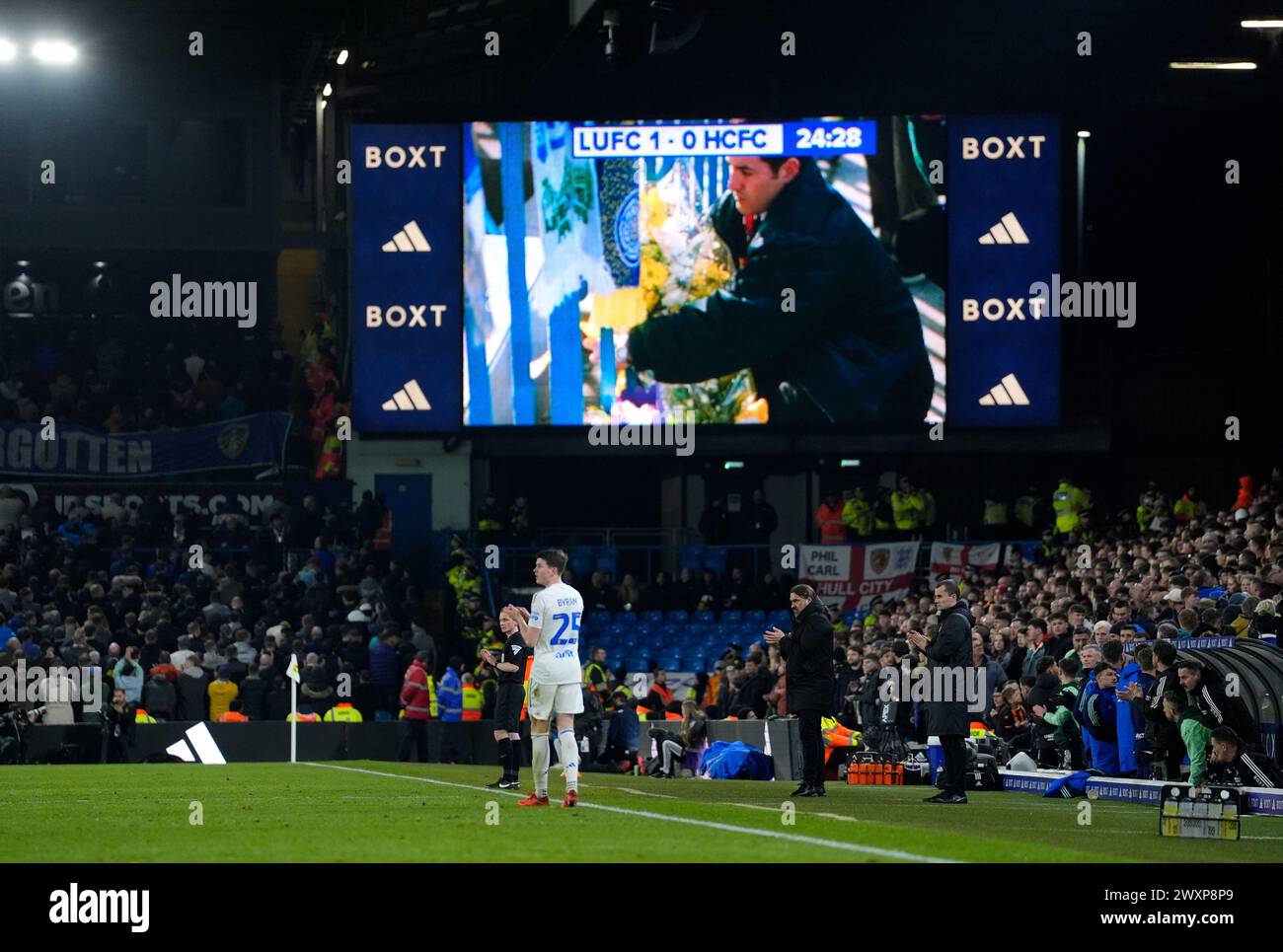 Leeds United fans and players applaud on the 24th minute to remember ...