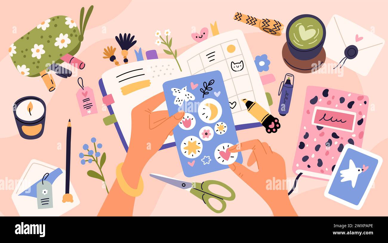 Hands write top view. Female hands stick stickers in diary. Woman ...