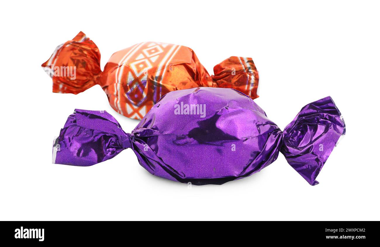 Sweet candies in colorful wrappers on white background Stock Photo - Alamy