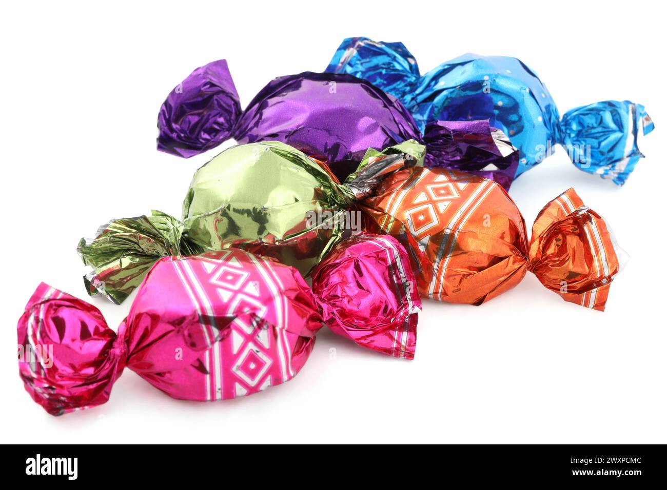Sweet candies in colorful wrappers on white background Stock Photo - Alamy