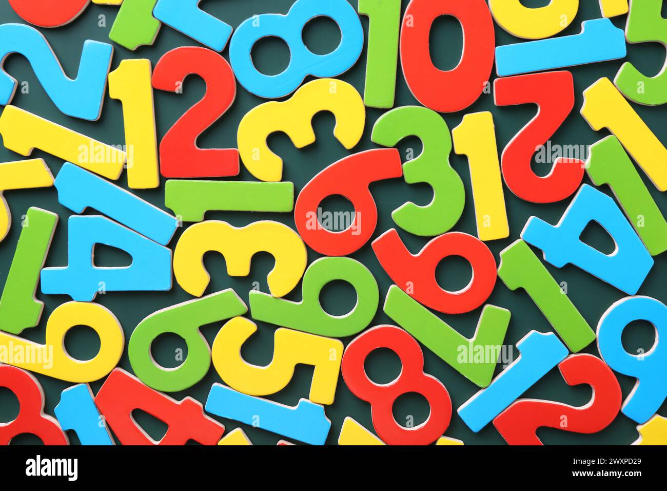 Colorful numbers on green background, top view Stock Photo - Alamy