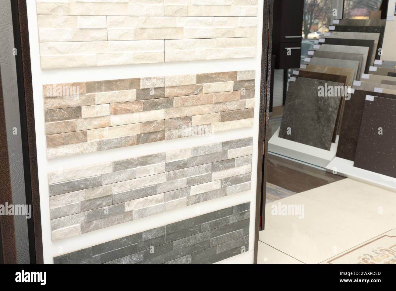 Many different samples of tiles on display in store Stock Photo - Alamy