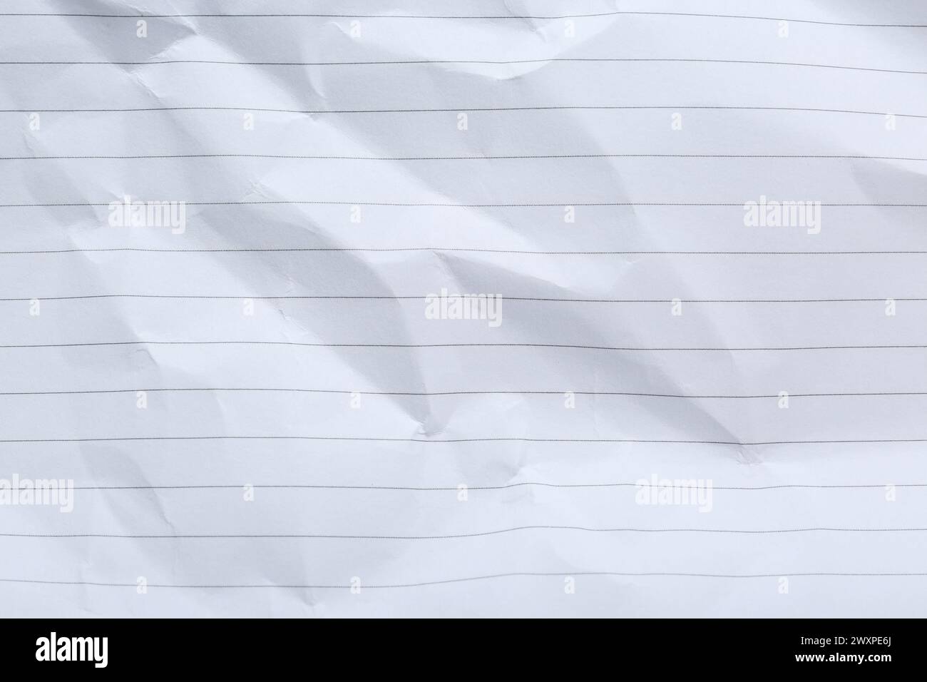Crumpled lined notebook sheet as background, top view Stock Photo - Alamy