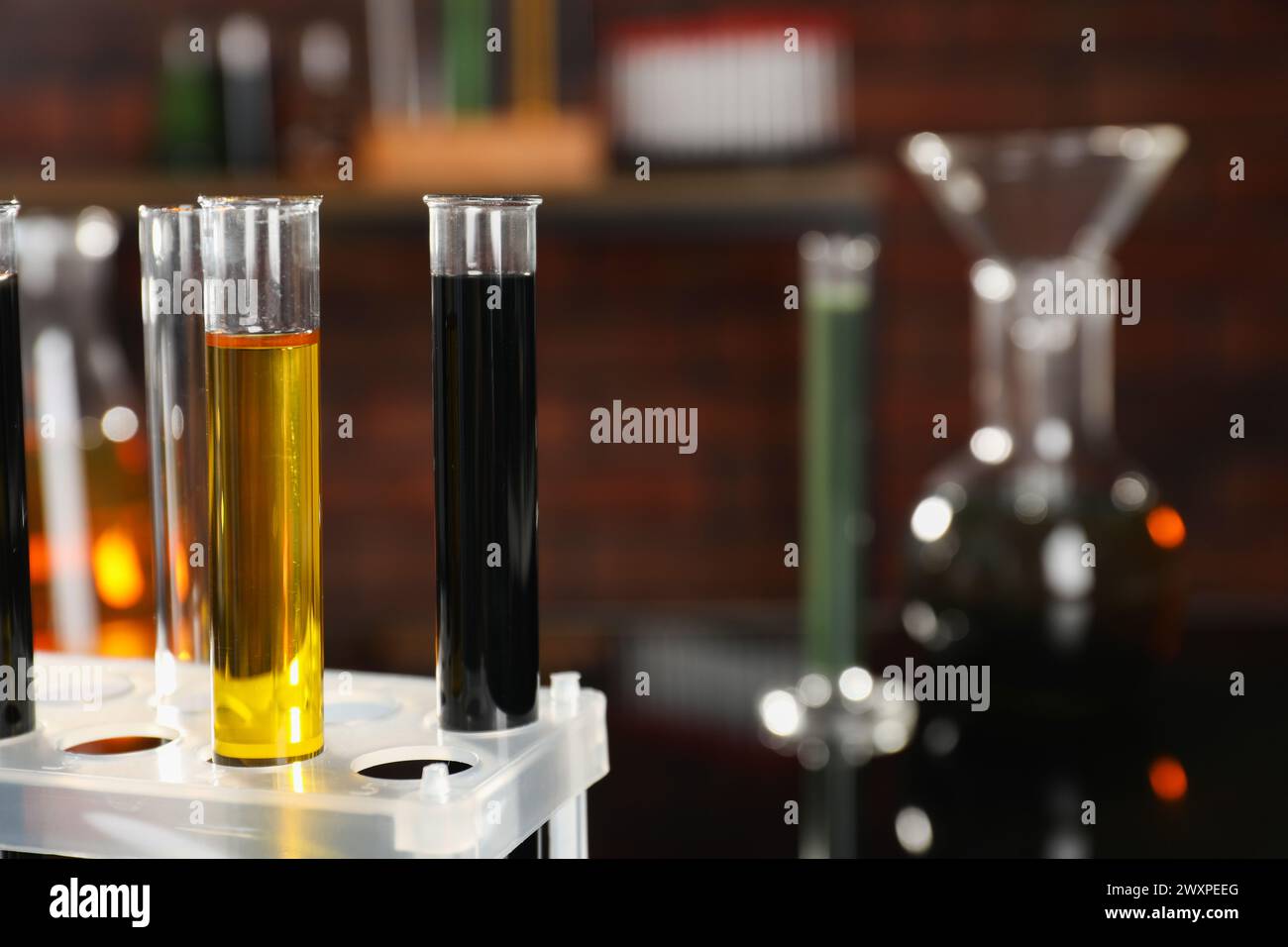 Laboratory glassware with different types of oil, closeup Stock Photo ...