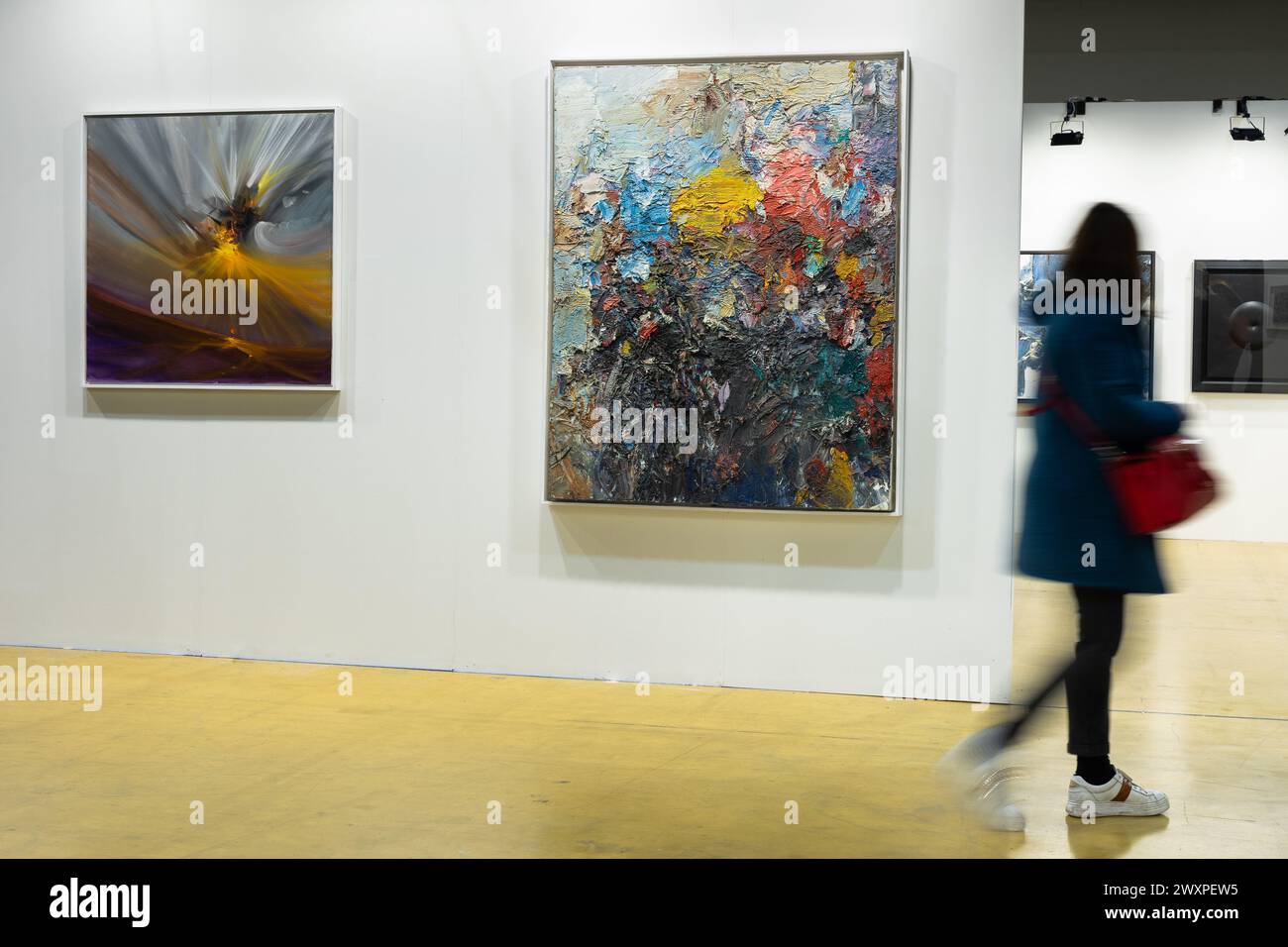 People Walking and Admiring Paintings in a Modern Art Gallery Stock ...
