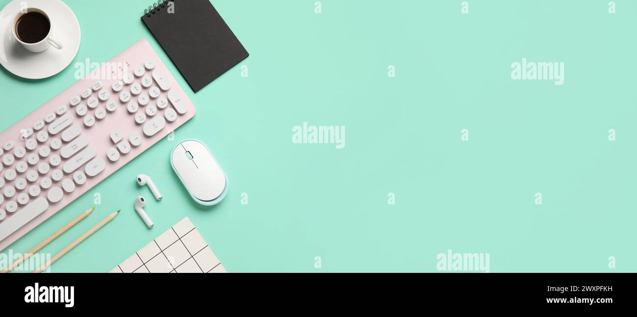 Wireless keyboard with computer mouse, earphones, cup of coffee and ...