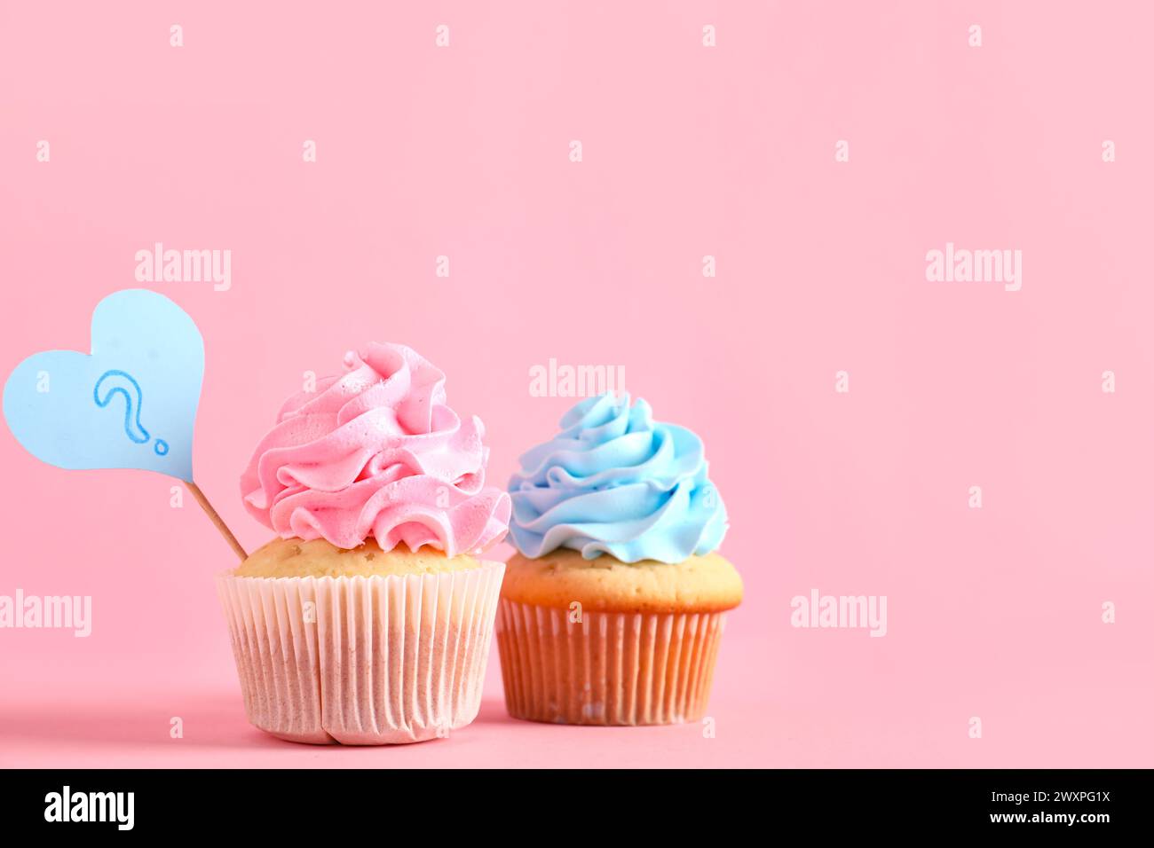 Delicious cupcakes with question mark on color background. Gender ...