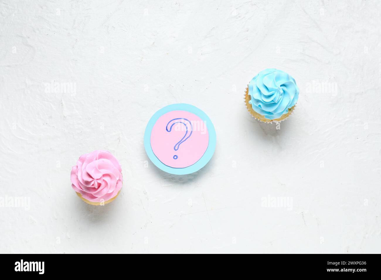 Delicious cupcakes with question mark on white background. Gender ...