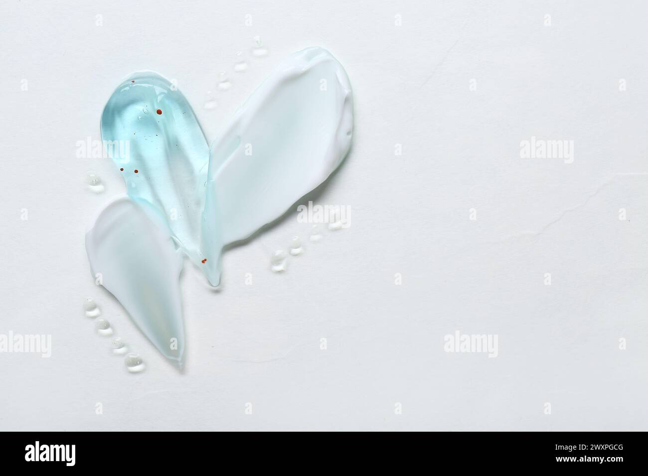 Samples of cosmetic cream and scrub on white background Stock Photo - Alamy