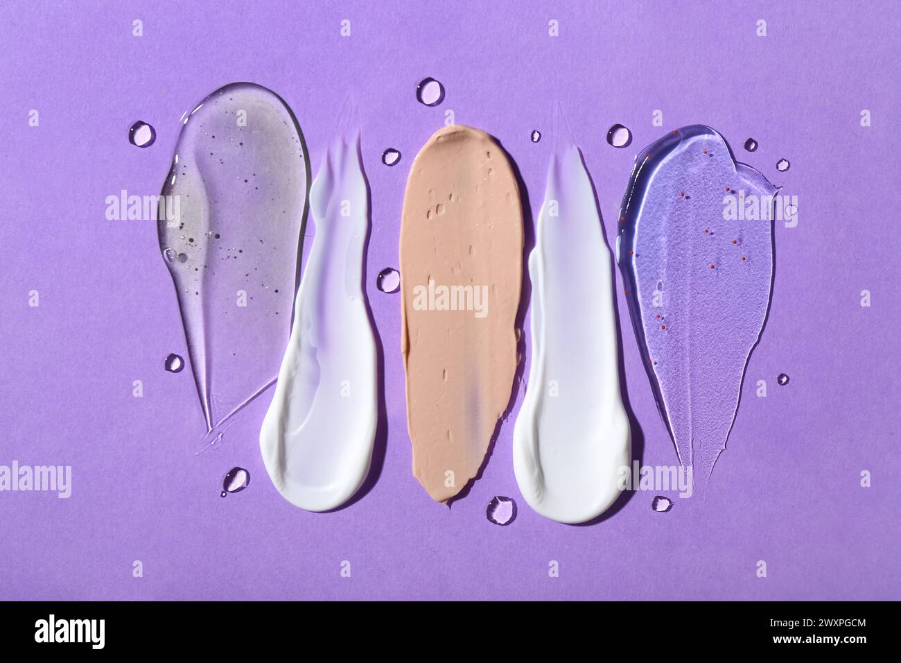 Samples of cosmetic cream with scrub, gel and makeup foundation on ...